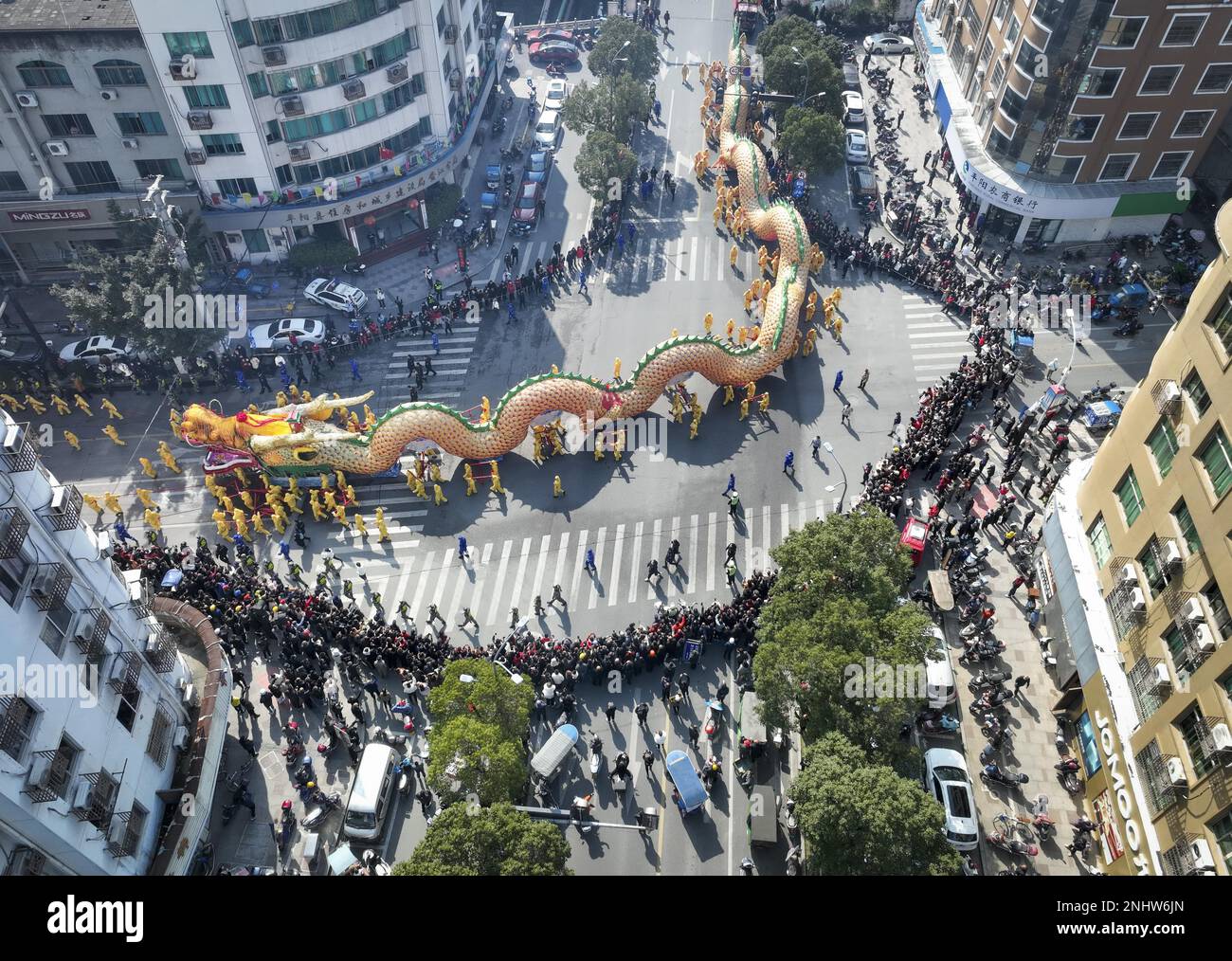 People participate in a parade carrying an 88-meter-long dragon for ...