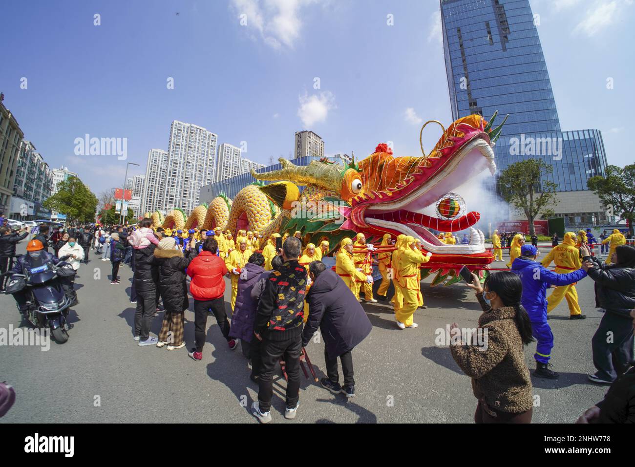 People participate in a parade carrying an 88-meter-long dragon for ...