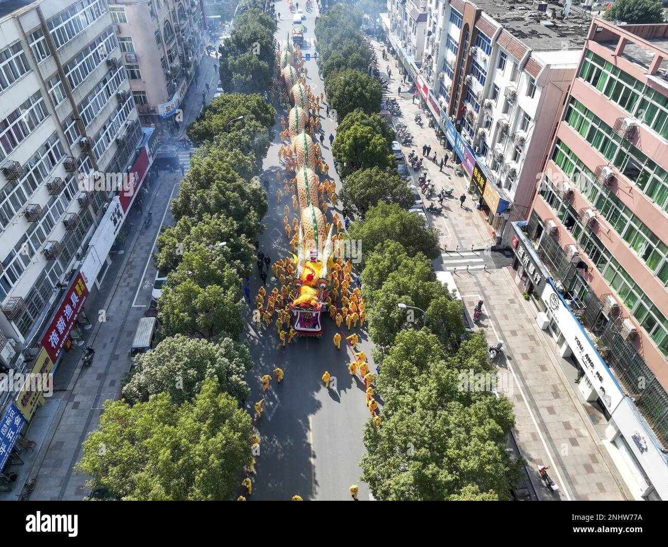 People participate in a parade carrying an 88-meter-long dragon for ...