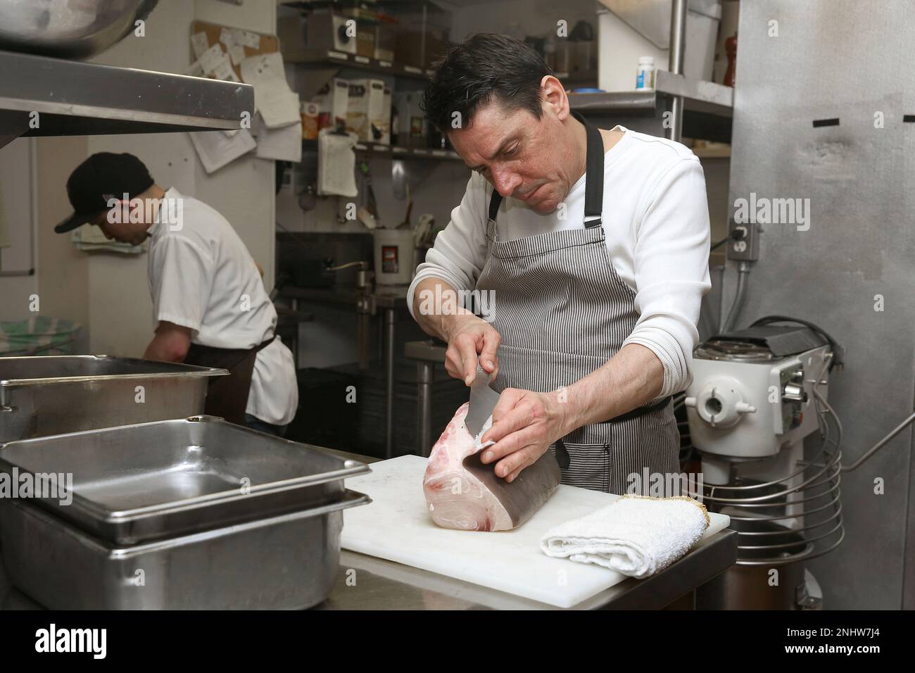 Executive chef George Morrone filets tuna at Fish & Farm in the ...