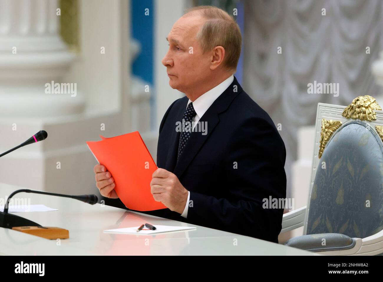 Russian President Vladimir Putin chairs a meeting with members of the ...