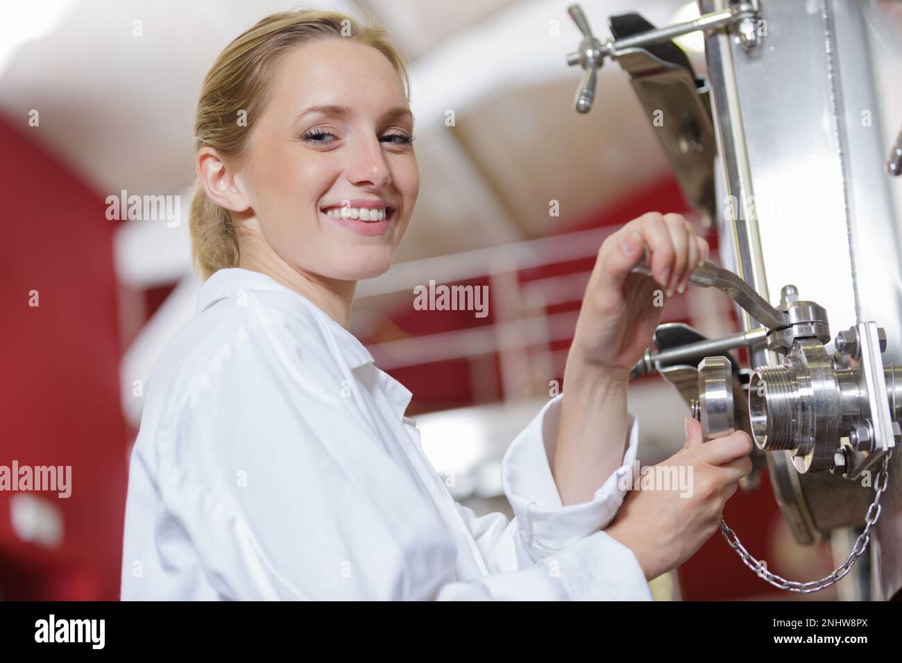 a happy female food factory worker Stock Photo - Alamy