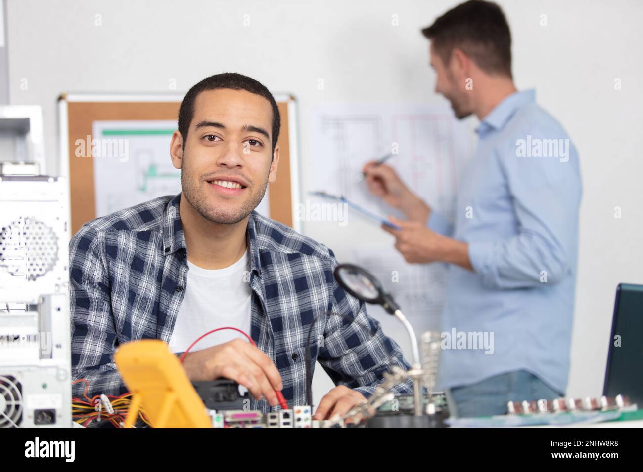 electronic engineers check digital multimeter indicators Stock Photo ...