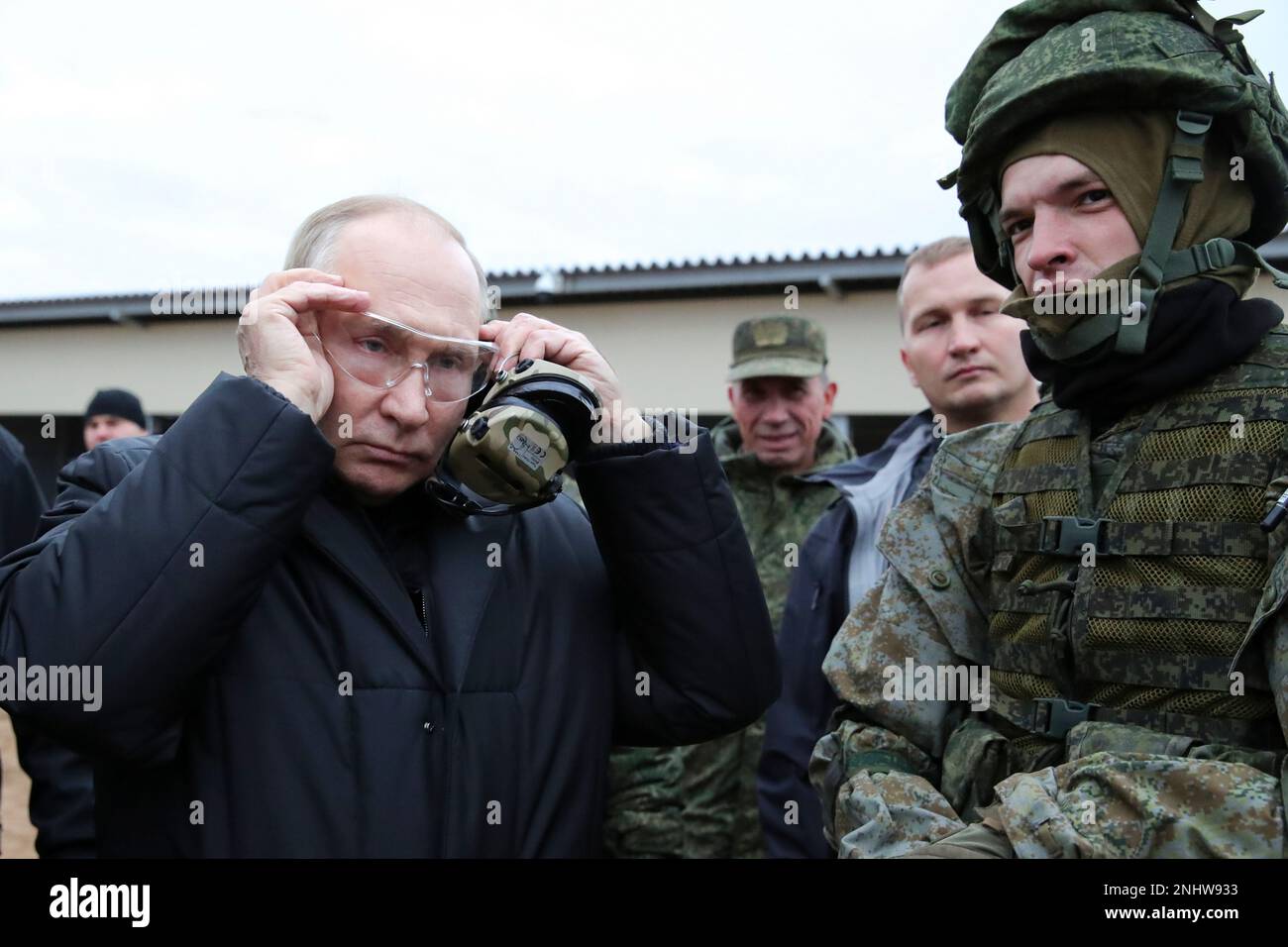 FILE - Russian President Vladimir Putin puts on protective glasses as ...