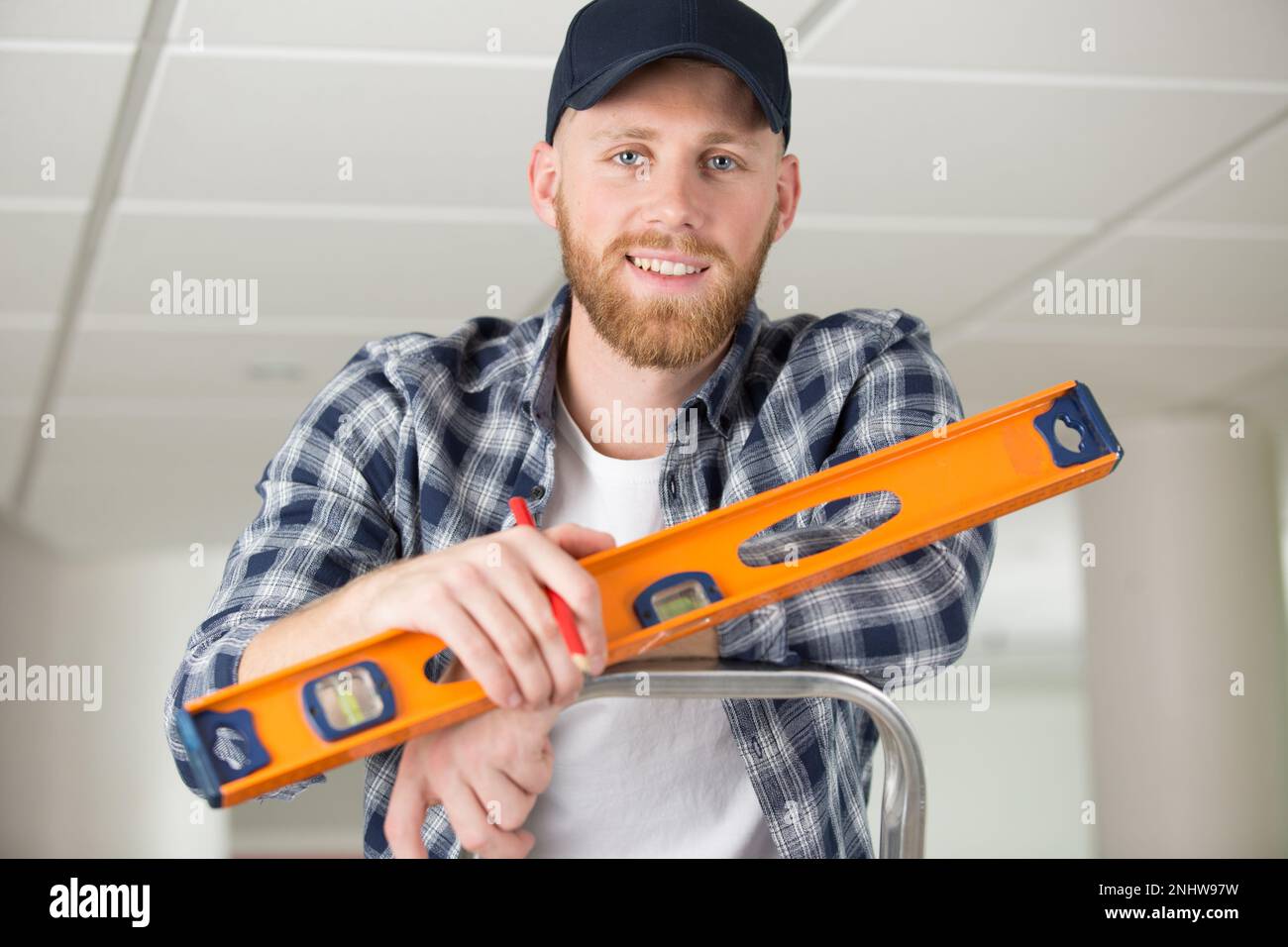 handyman contractor smiling at the camera Stock Photo - Alamy