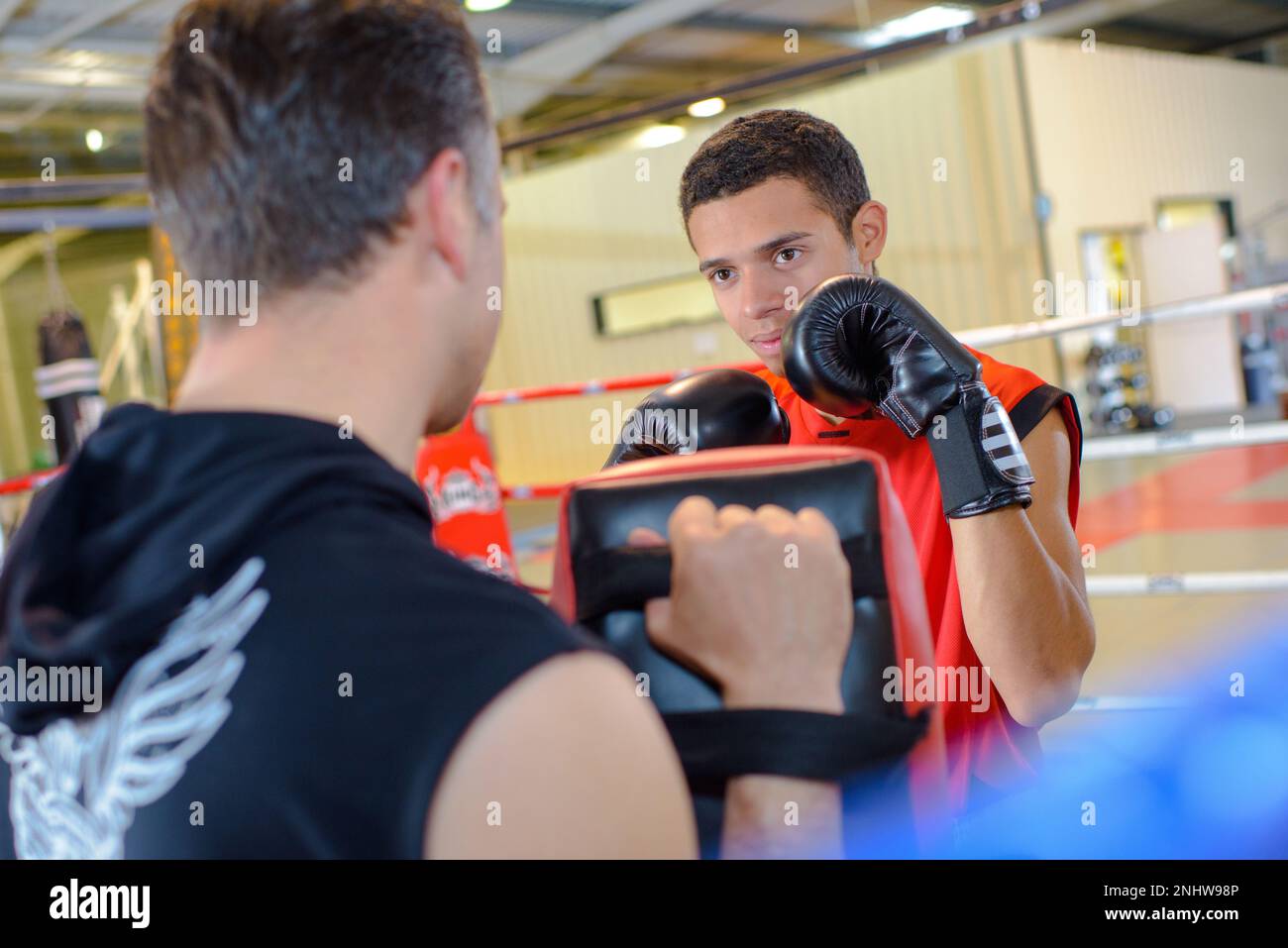 coach and man in boxing class Stock Photo - Alamy