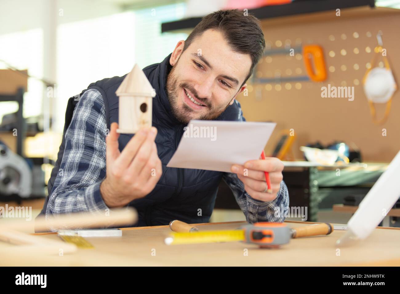 carpenter building a wooden nesting box Stock Photo - Alamy