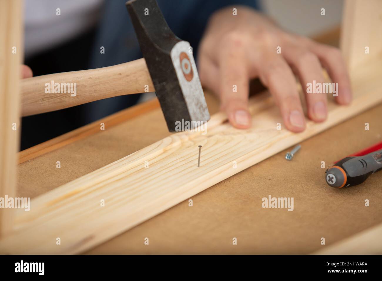 carpenter uses a tool in hand Stock Photo - Alamy