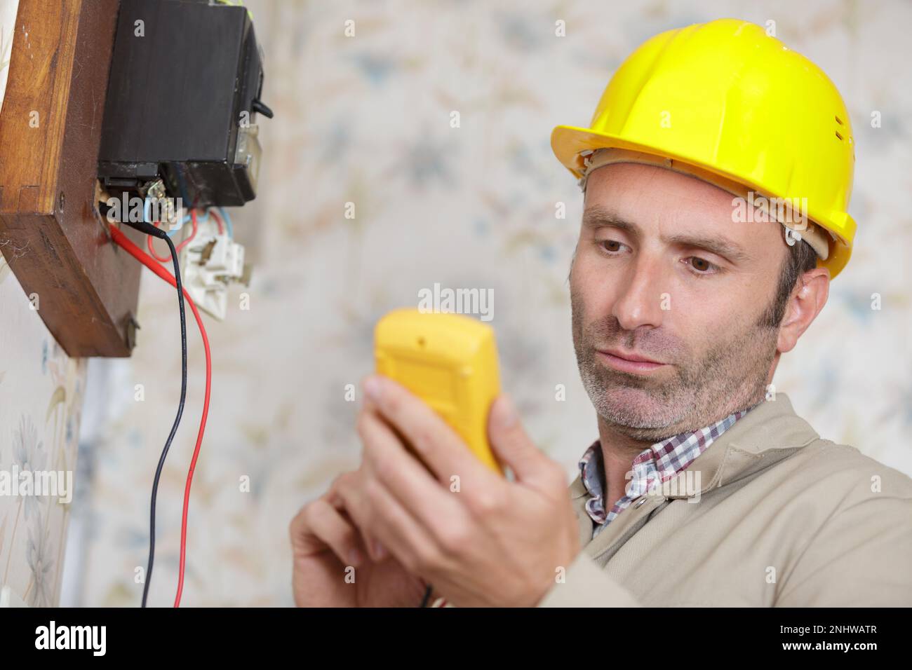 electrician using a multimeter on an electricity meter Stock Photo - Alamy
