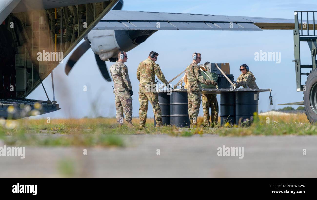 U.S. Airmen assigned to the 424th Air Base Squadron check the cargo ...