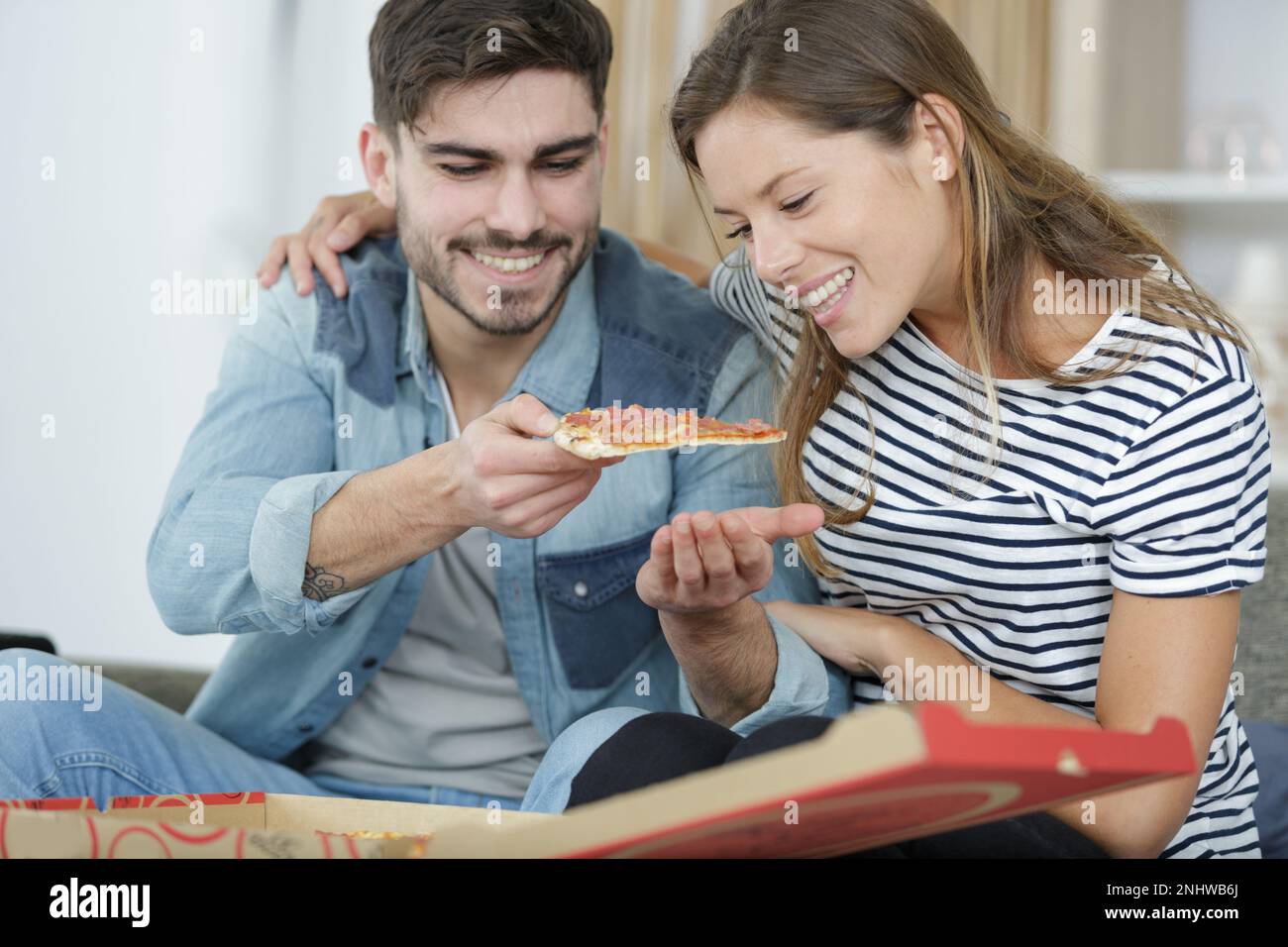 Happy couple making pizza hi-res stock photography and images - Alamy