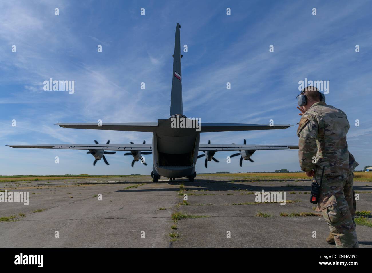 U.S. Airmen assigned to the 424th Air Base Squadron look on as some of ...