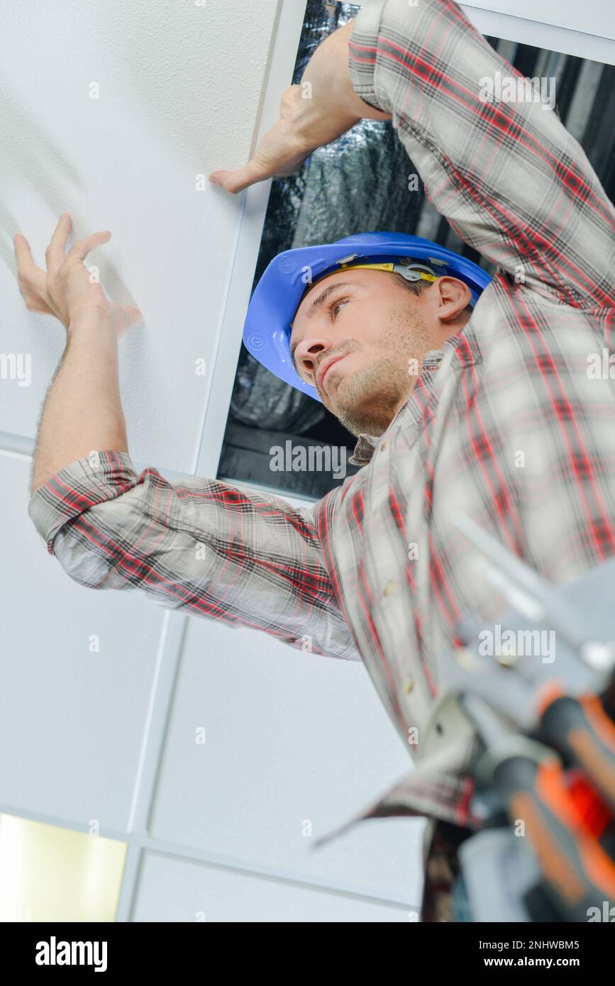 an electrician up a ladder Stock Photo - Alamy