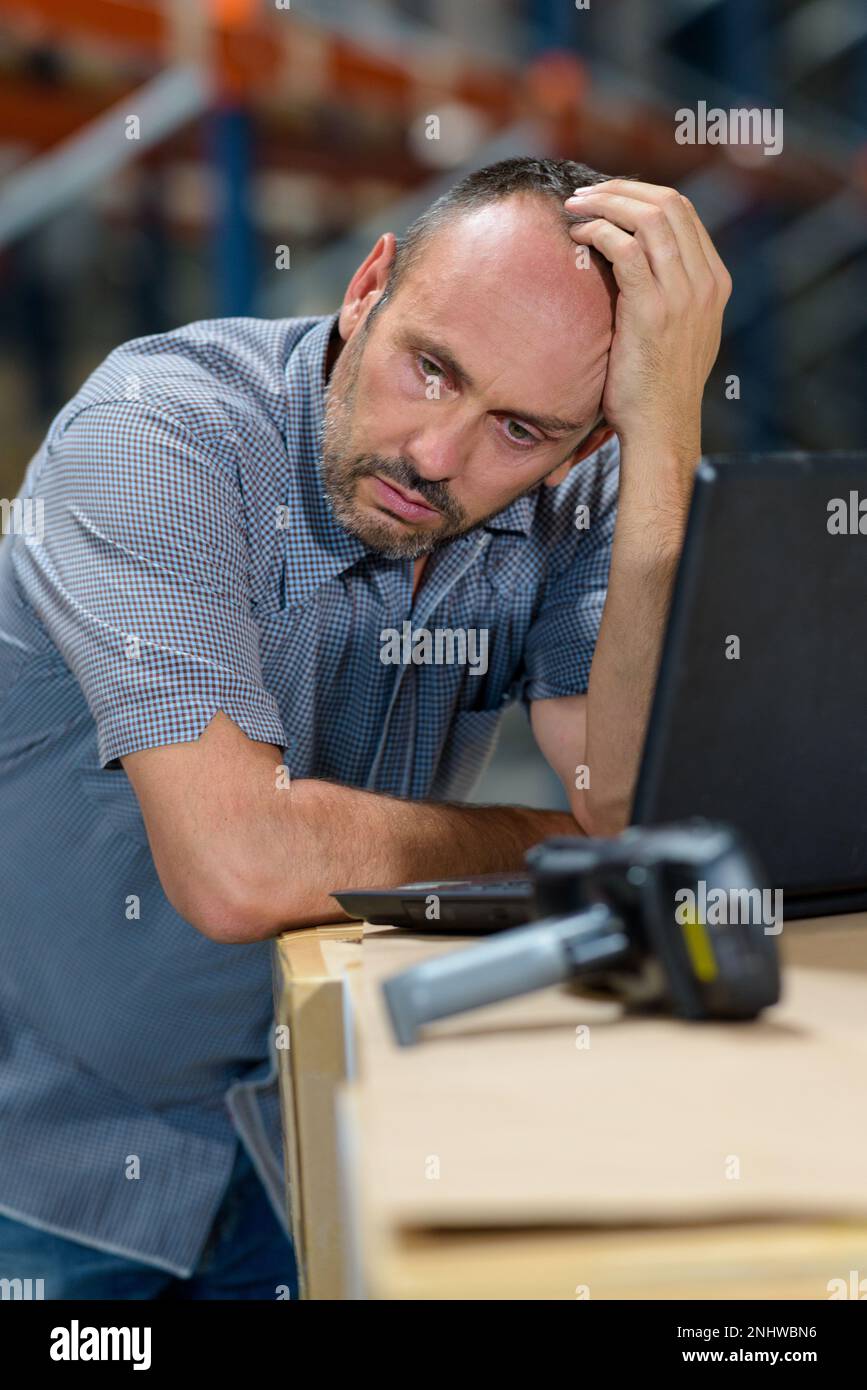 a tired male plant worker Stock Photo - Alamy