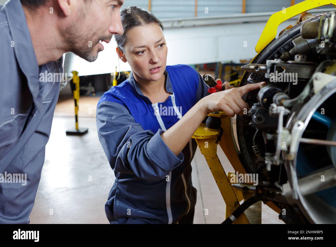 two engineers fixing an engine Stock Photo - Alamy