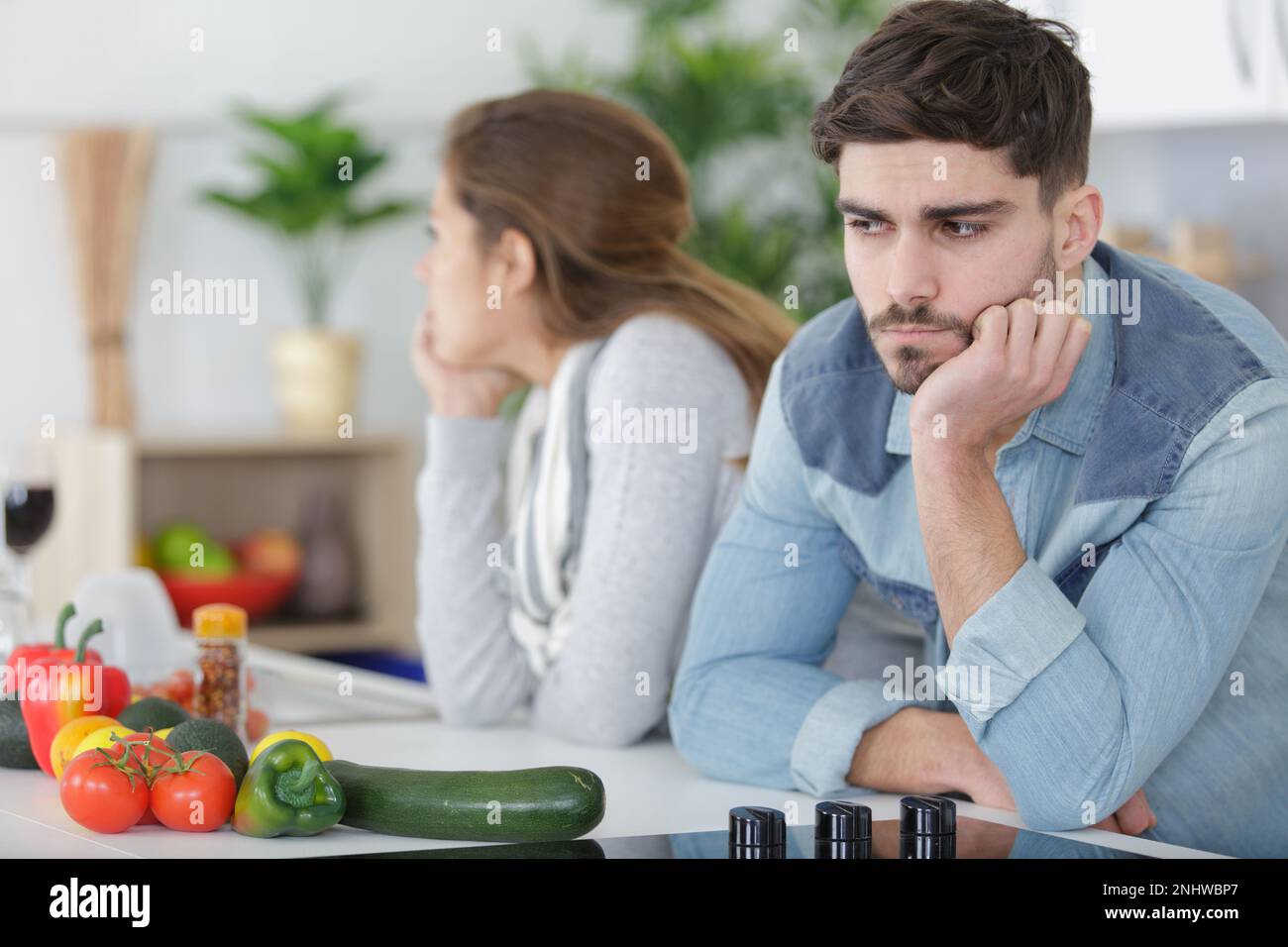 Couple and kitchen table and upset hi-res stock photography and images ...