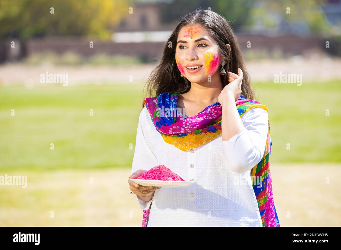 Portrait of attractive pretty young Indian woman wearing white cloths ...