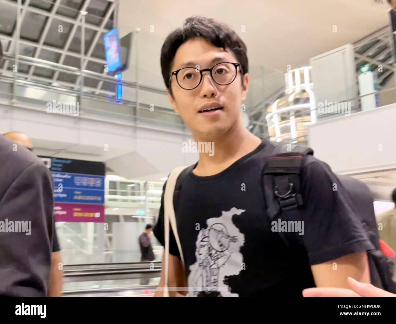 Japanese filmmaker Toru Kubota walks at an airport on the outskirts of Bangkok, Thailand ...