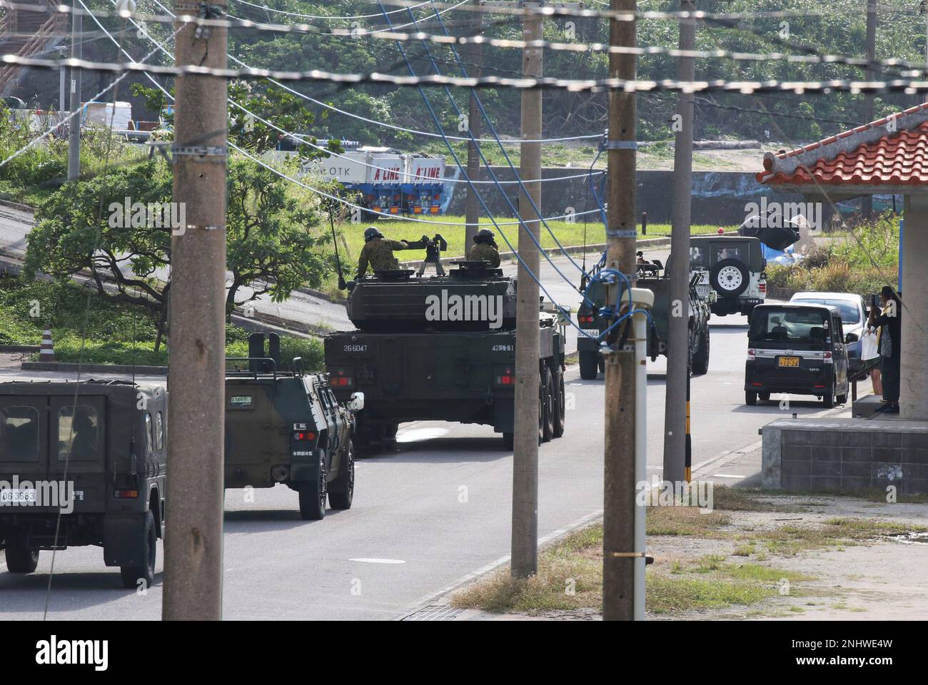 Type 16 maneuver combat vehicle (16MCV) runs through the city toward ...