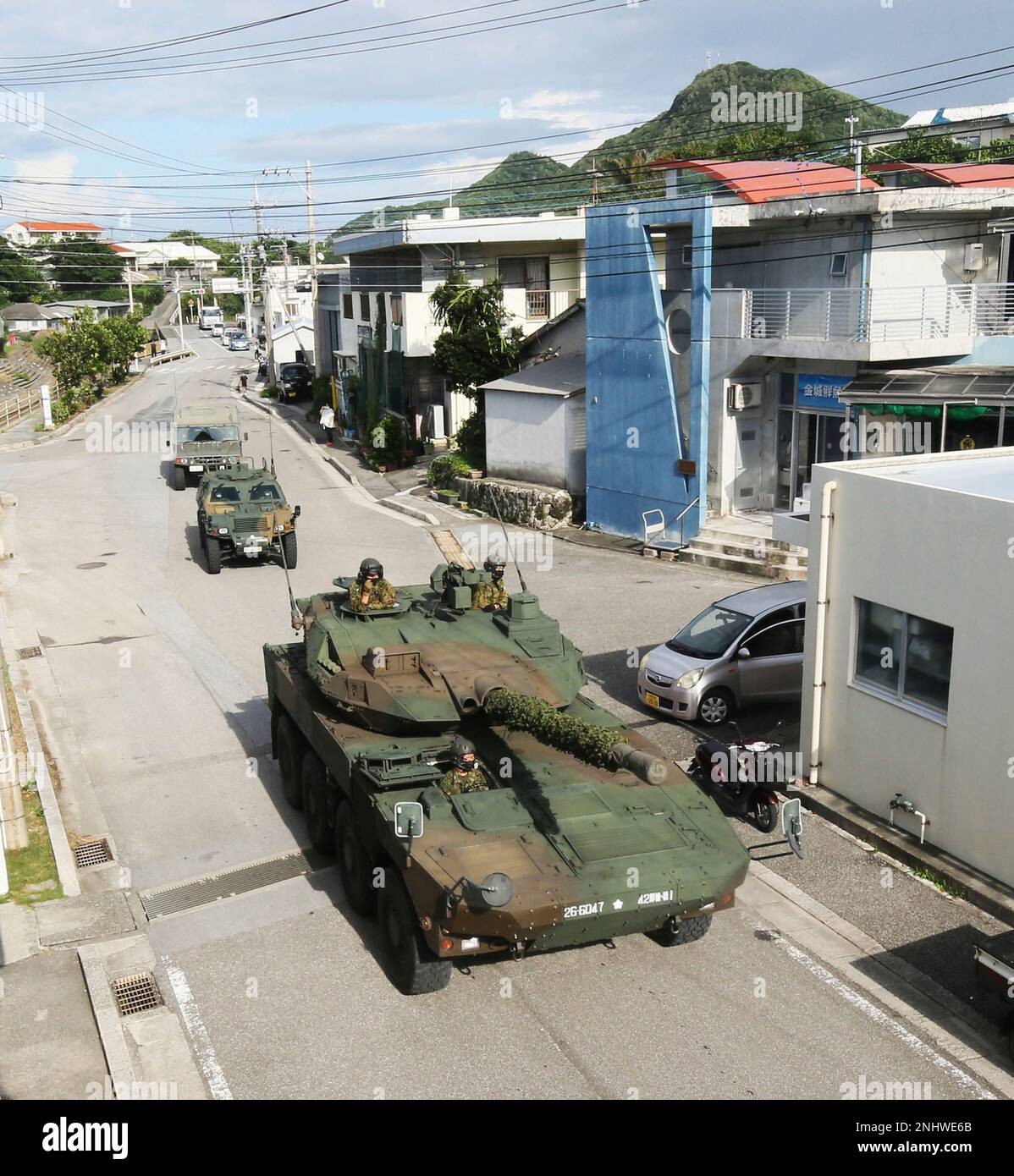 Type 16 maneuver combat vehicle (16MCV) runs through the city toward ...