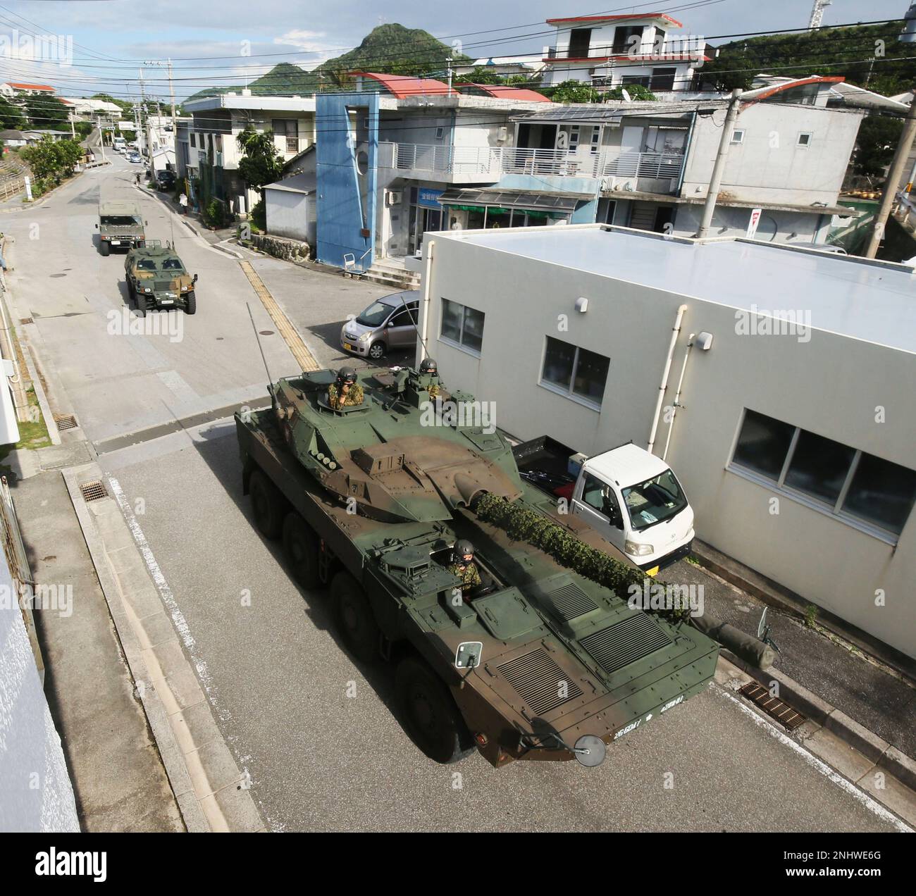 Type 16 maneuver combat vehicle (16MCV) runs through the city toward ...