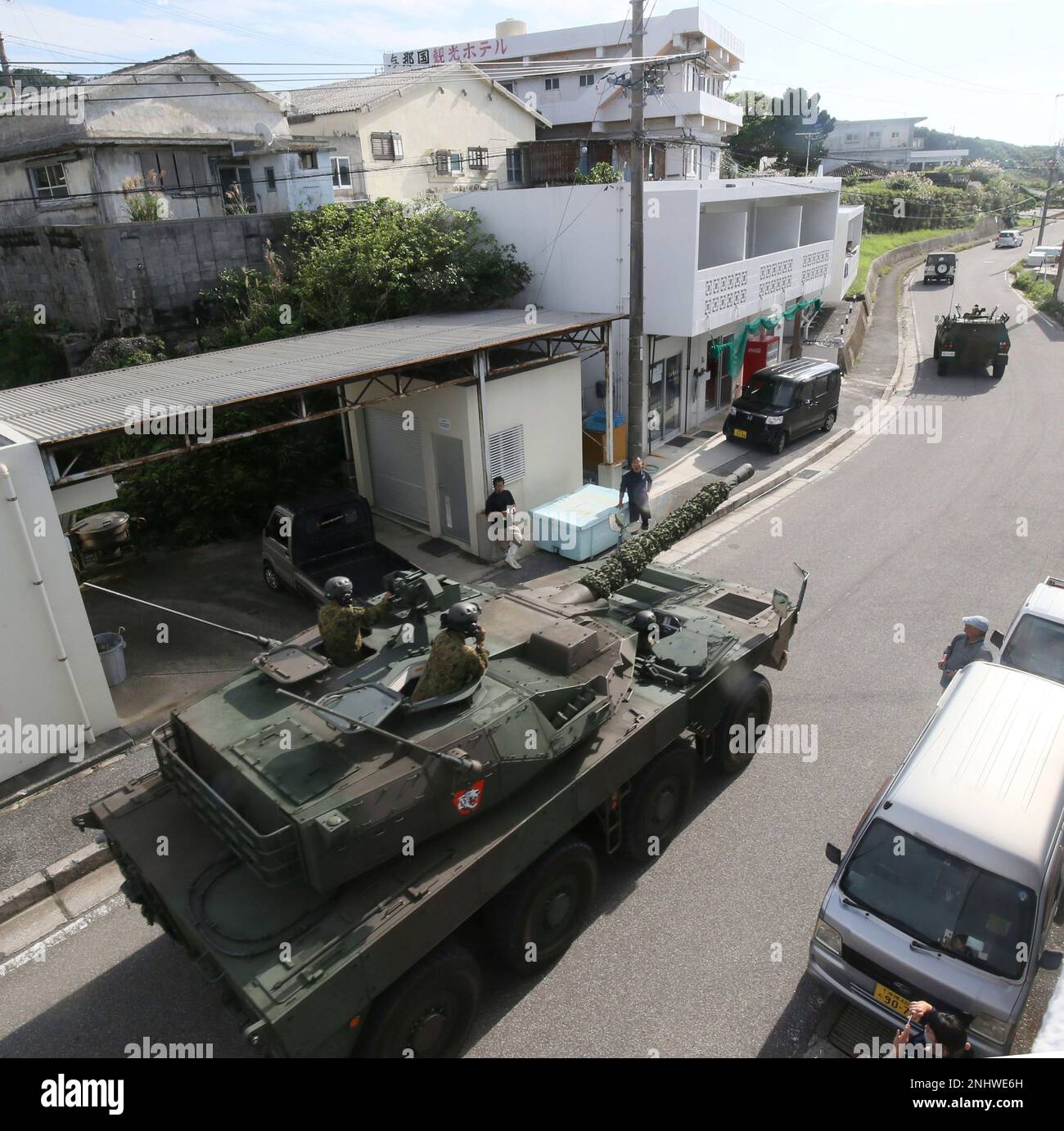 Type 16 maneuver combat vehicle (16MCV) runs through the city toward ...