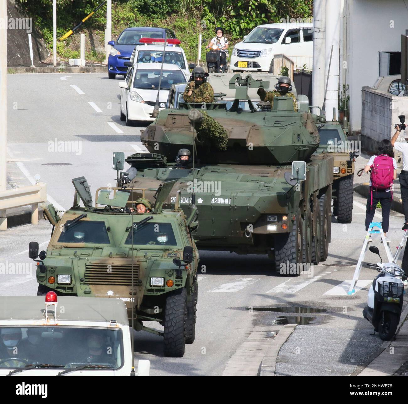 Type 16 maneuver combat vehicle (16MCV) runs through the city toward ...