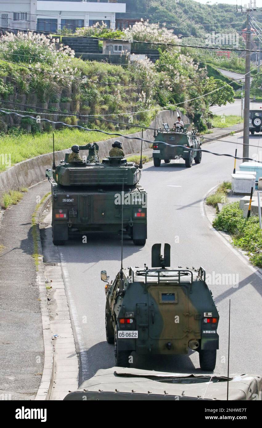 Type 16 maneuver combat vehicle (16MCV) runs through the city toward ...
