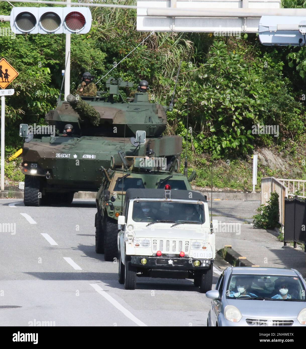 Type 16 maneuver combat vehicle (16MCV) runs through the city toward ...