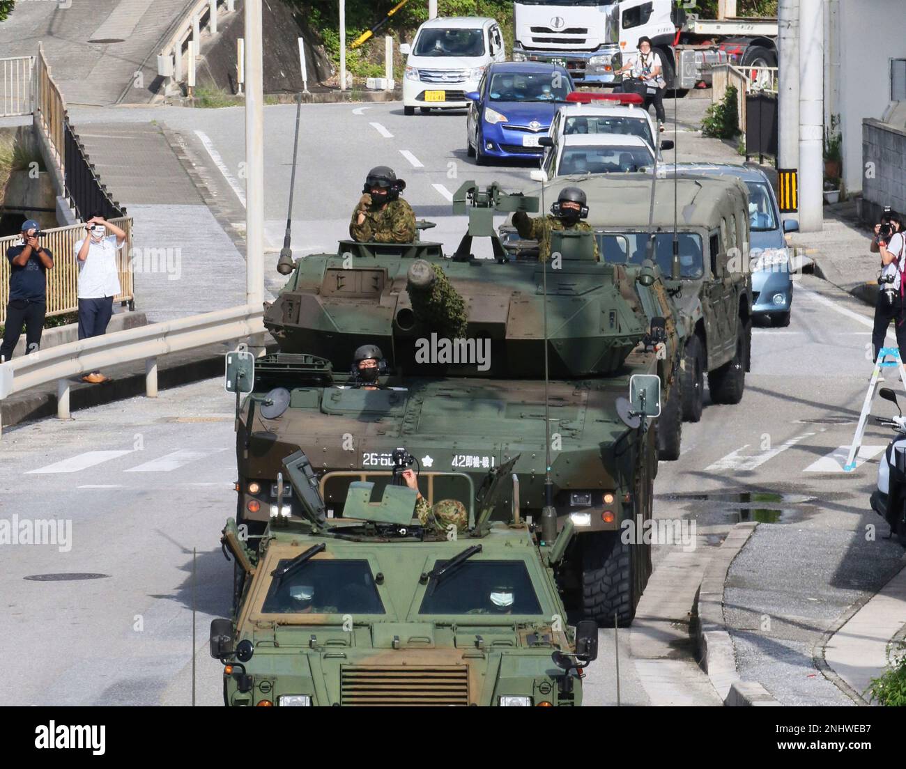 Type 16 maneuver combat vehicle (16MCV) runs through the city toward ...