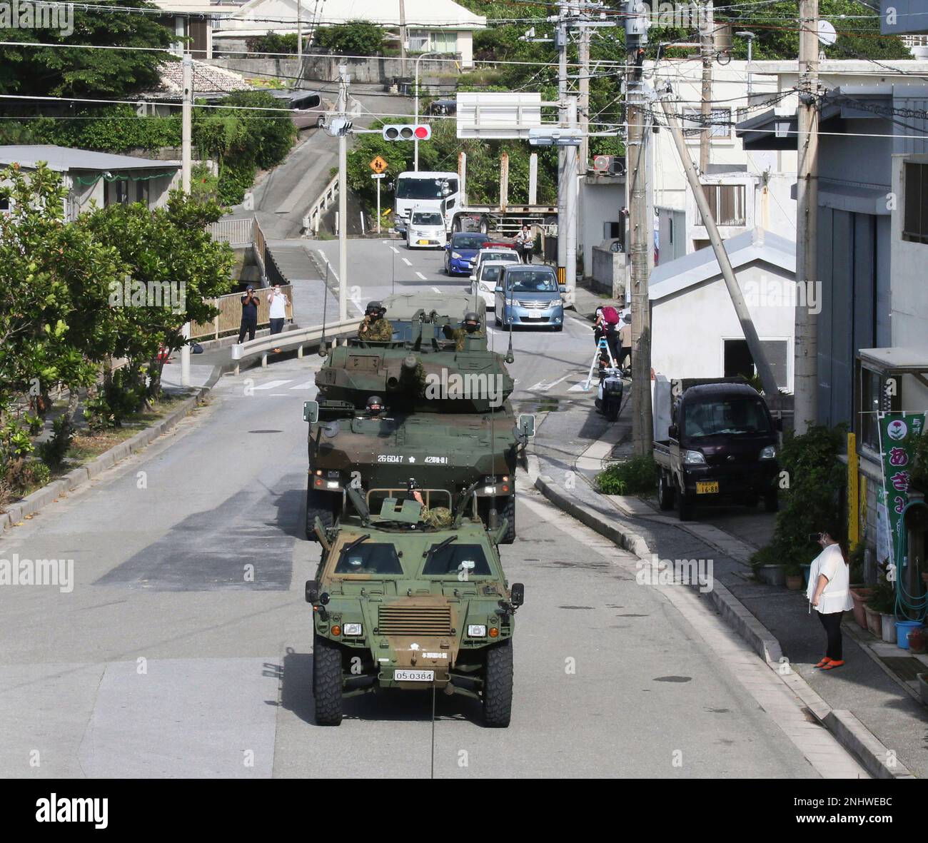 Type 16 maneuver combat vehicle (16MCV) runs through the city toward ...