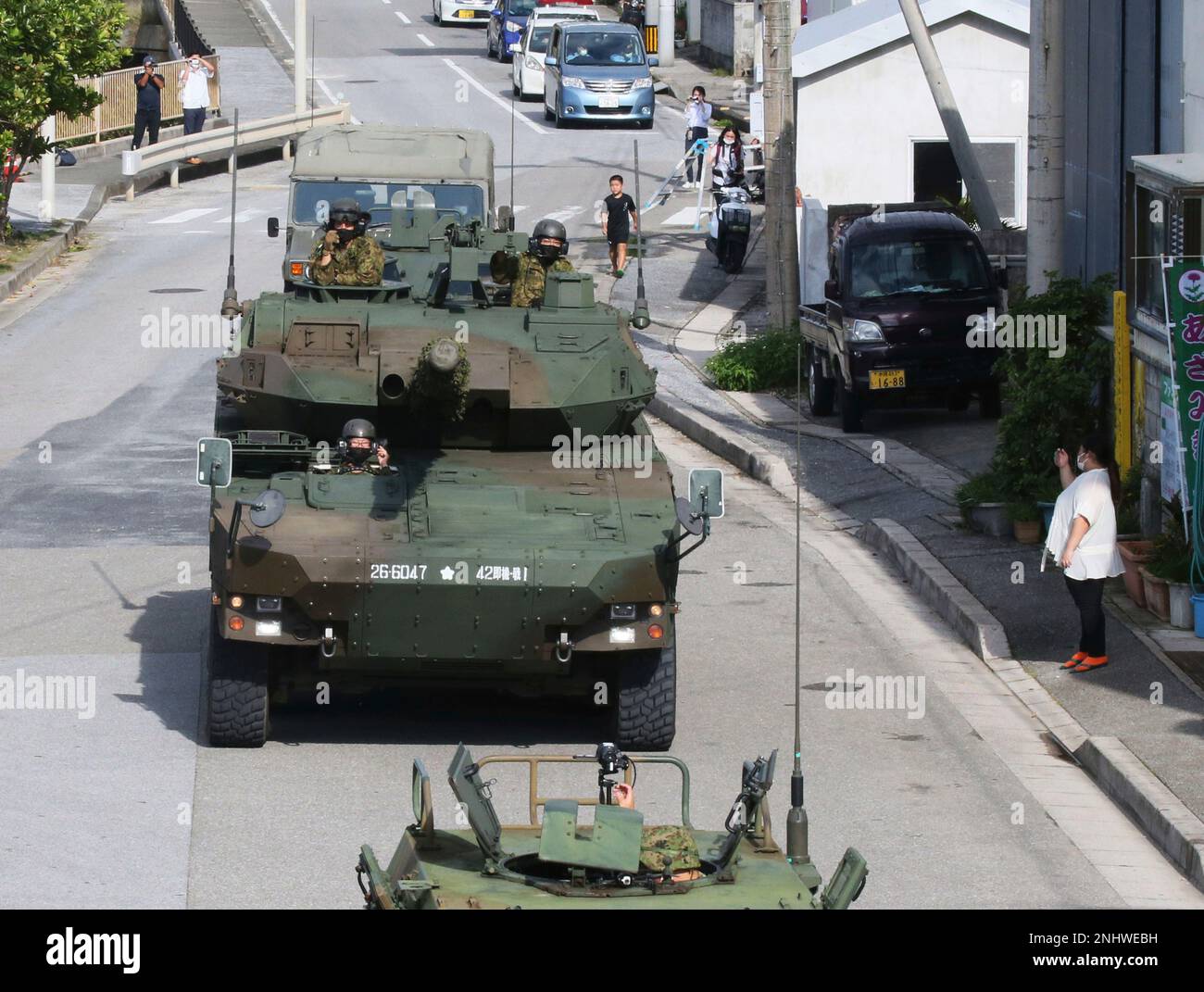 Type 16 maneuver combat vehicle (16MCV) runs through the city toward ...