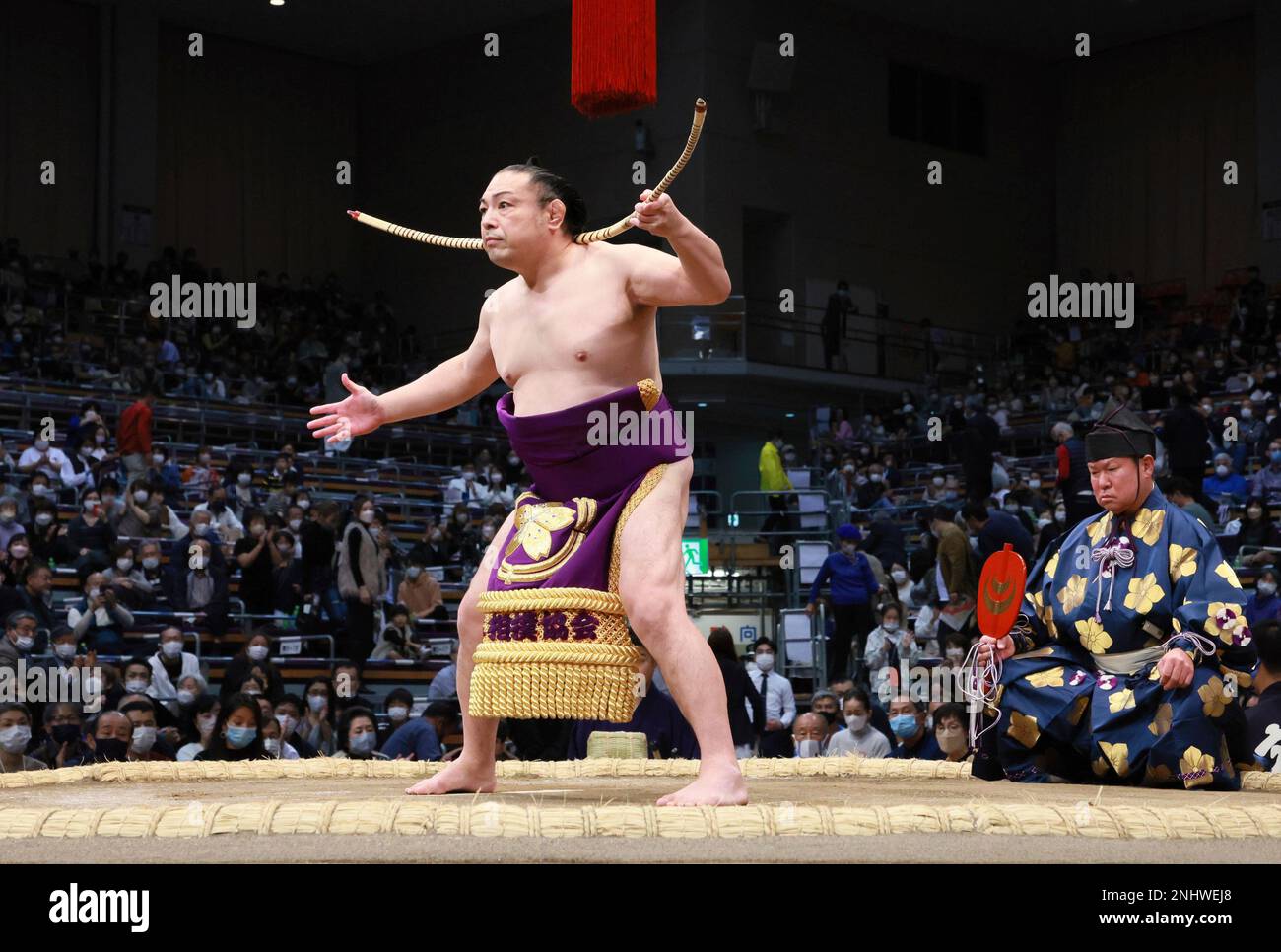A sumo wrestler Satonofuji attends the bow twirling ceremony during ...