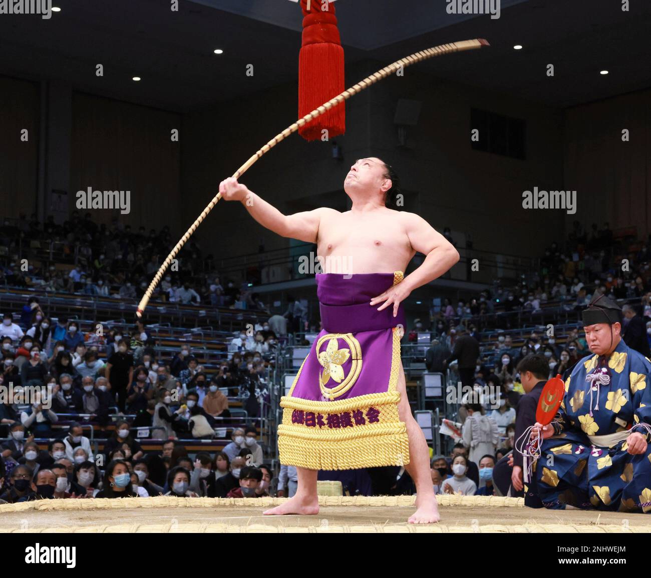 A sumo wrestler Satonofuji attends the bow twirling ceremony during ...