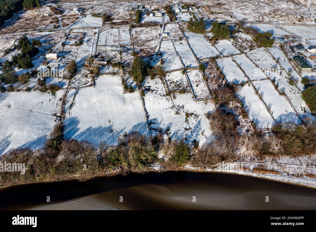 Aerial view of snow covered Gweebarra River between Doochary and ...