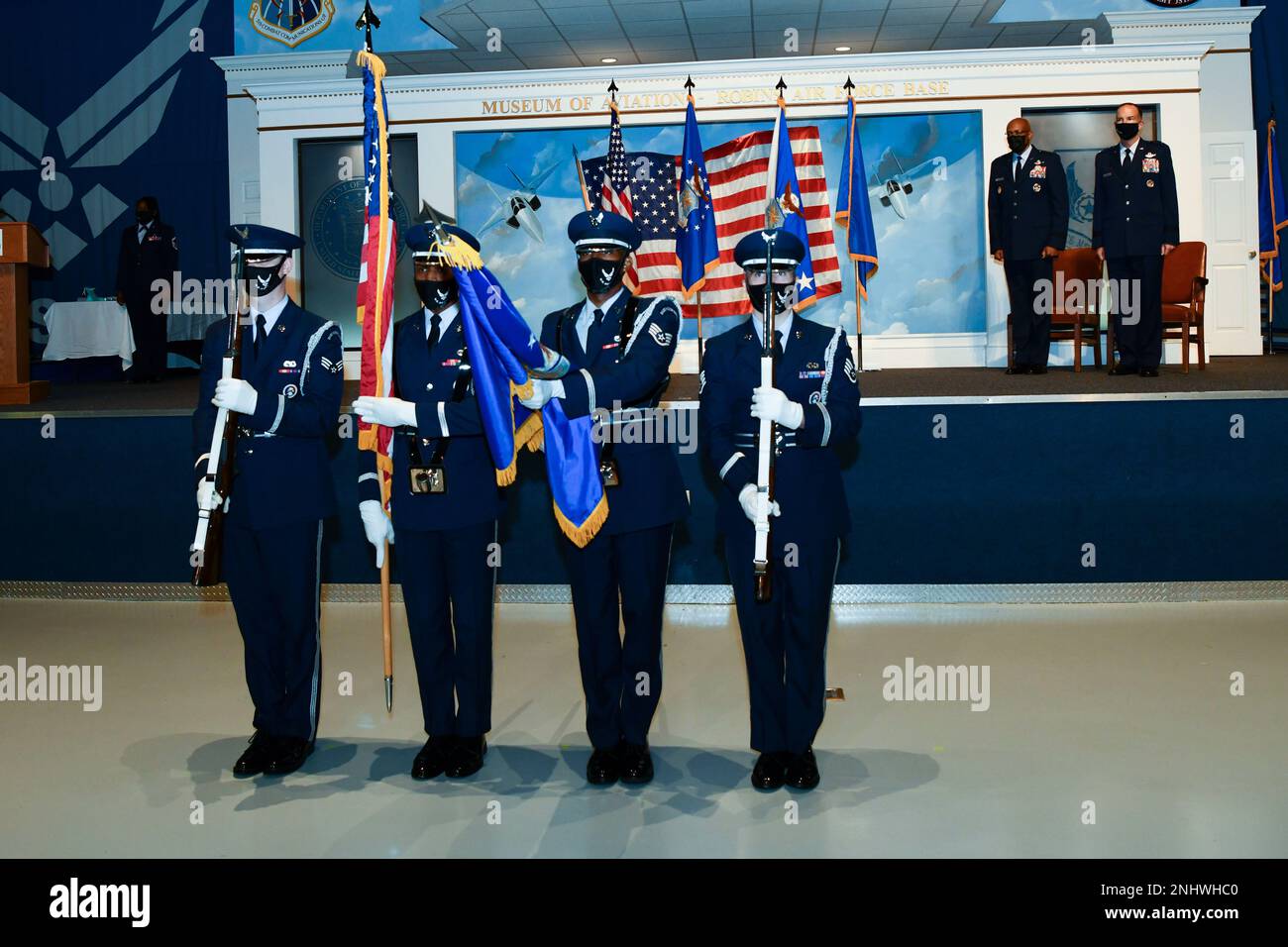 The honor guard posts the colors at the start of the promotion ceremony ...