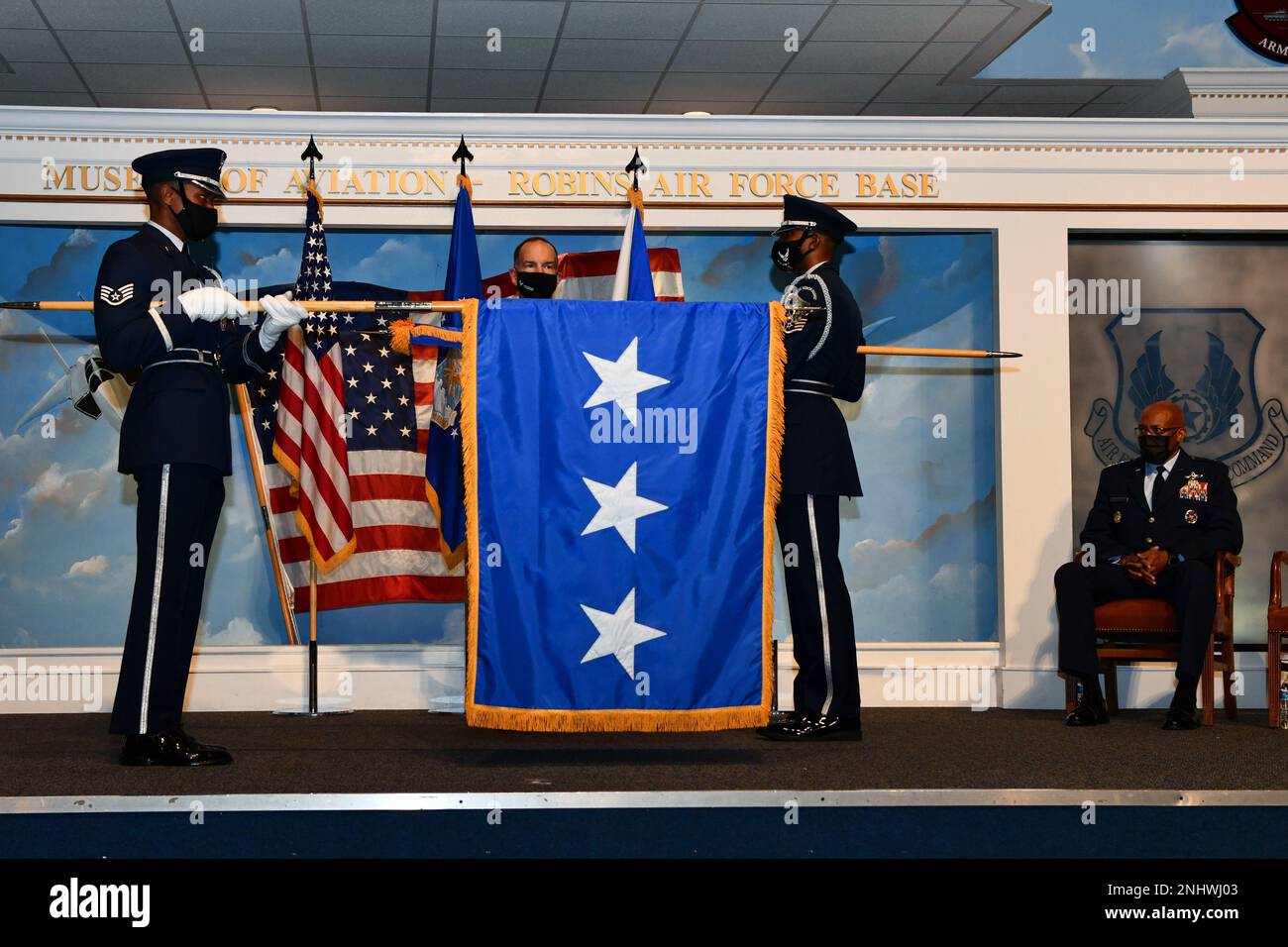 Honor Guard Airmen unfurl a three-star flag for Lt. Gen. John Healy ...