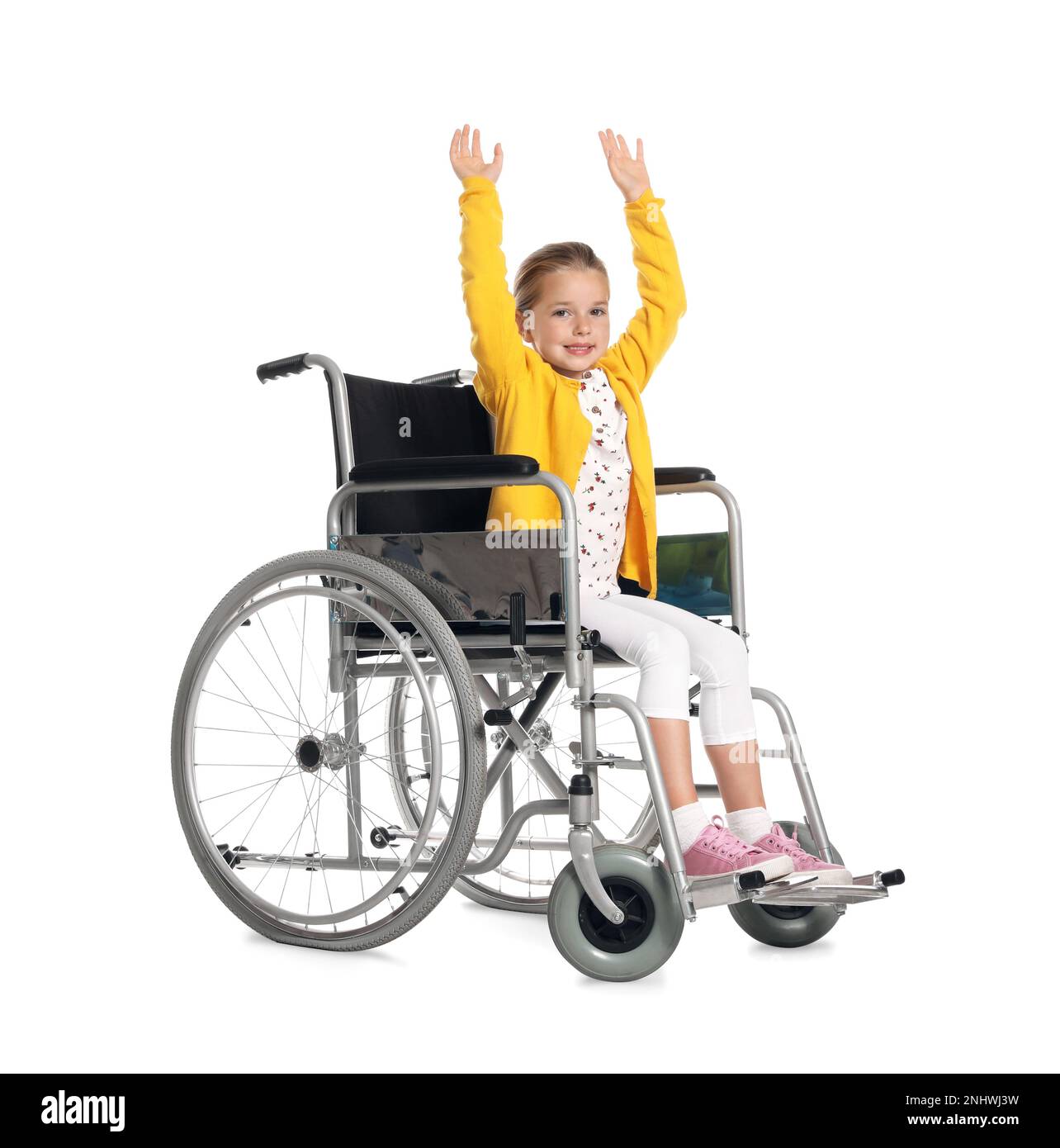 Little girl in wheelchair on white background Stock Photo - Alamy