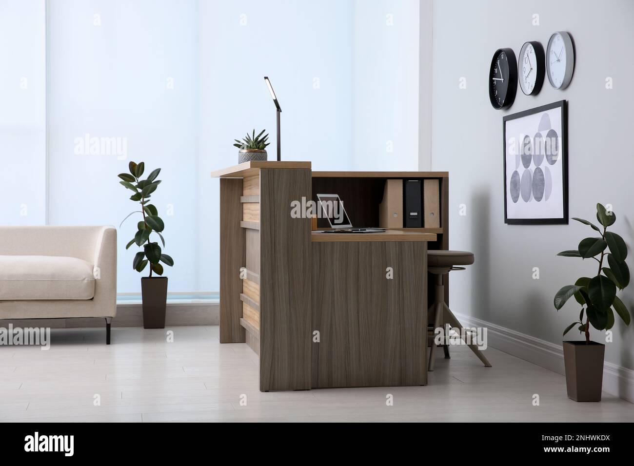Lobby interior with stylish wooden receptionist desk Stock Photo - Alamy