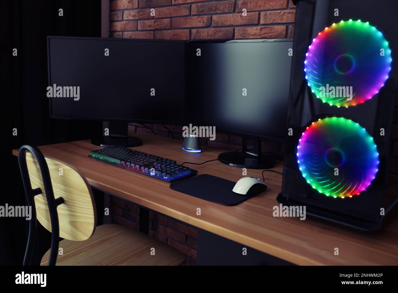 Modern computer and RGB keyboard on wooden table indoors Stock Photo ...