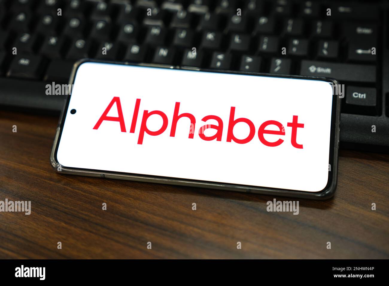 In this photo illustration, an Alphabet logo is displayed on the screen ...