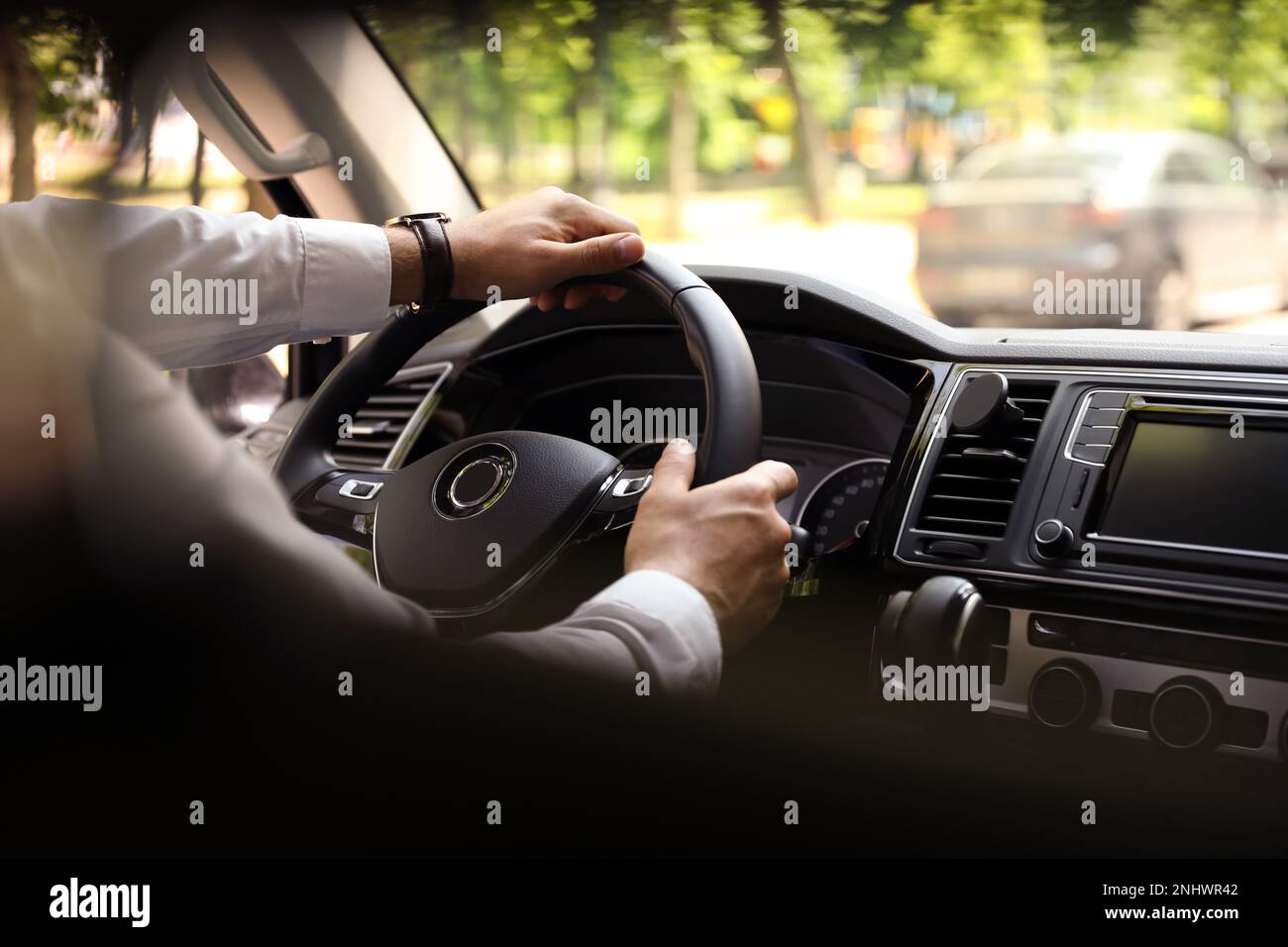 Man driving his car, closeup view of hands on steering wheel Stock ...