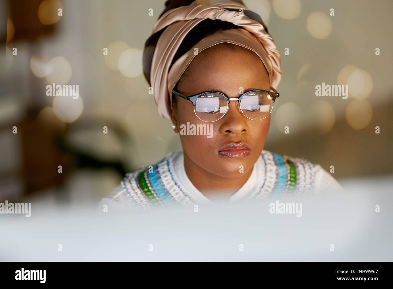 Black woman, face and reading on computer screen, focus and working ...