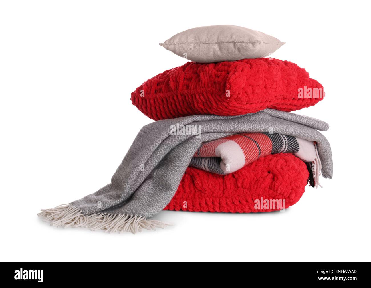 Stack of pillows and folded warm plaids on white background Stock Photo ...