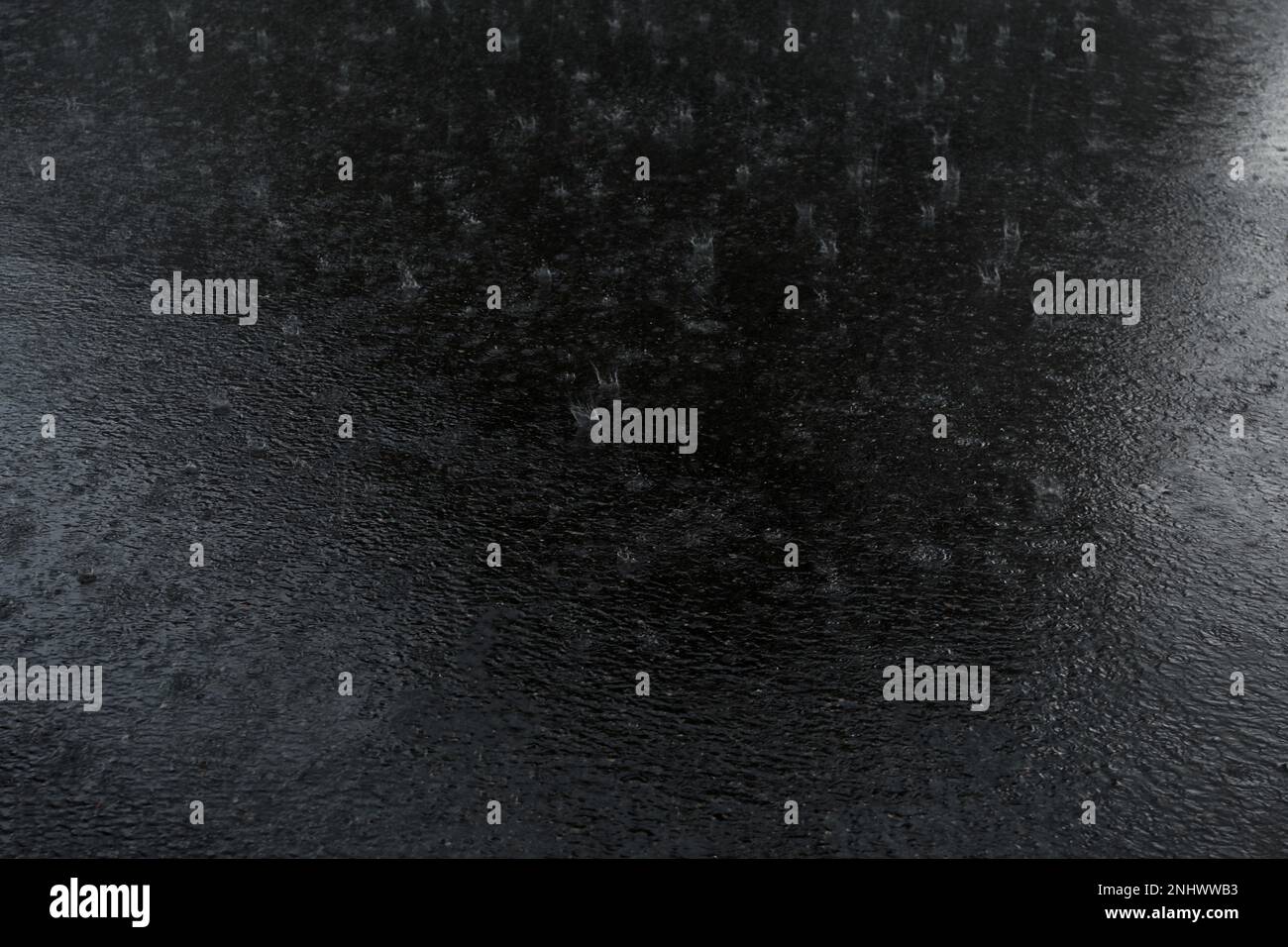 View of heavy pouring rain on city street Stock Photo - Alamy