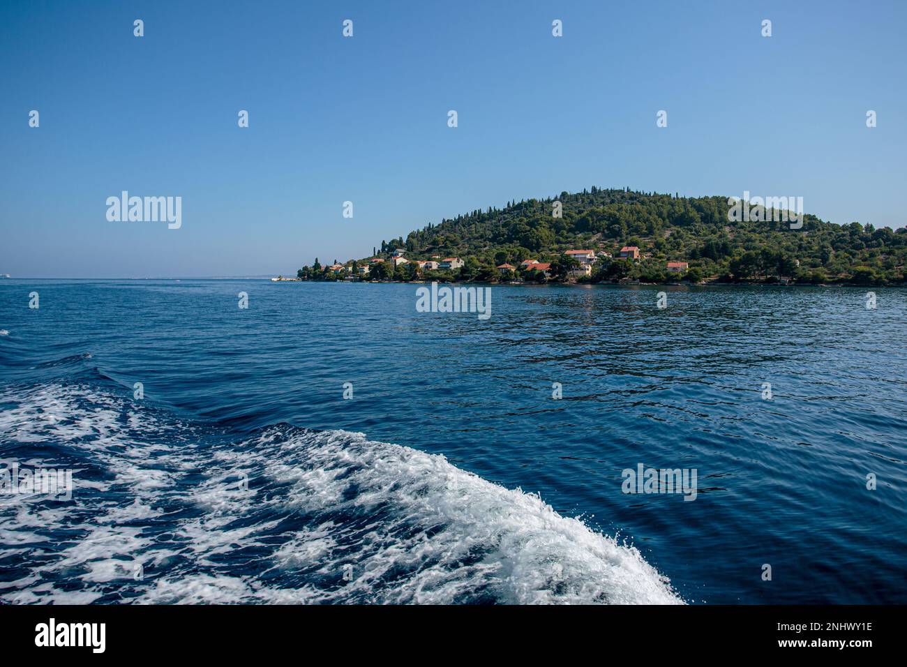A serene summer seascape on the Croatian island of Pasman, featuring ...