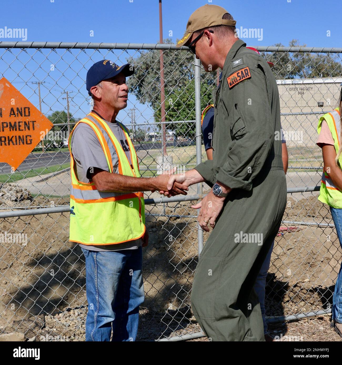 NAS Lemoore Commanding Officer CAPT Douglas M. Peterson presents a ...