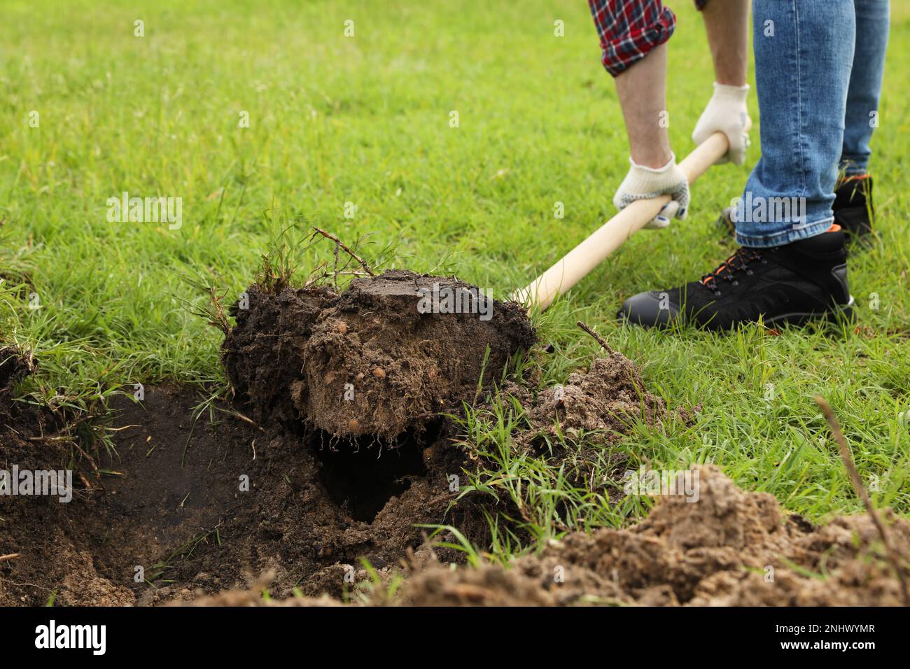 Worker digging soil with shovel outdoors, closeup Stock Photo - Alamy