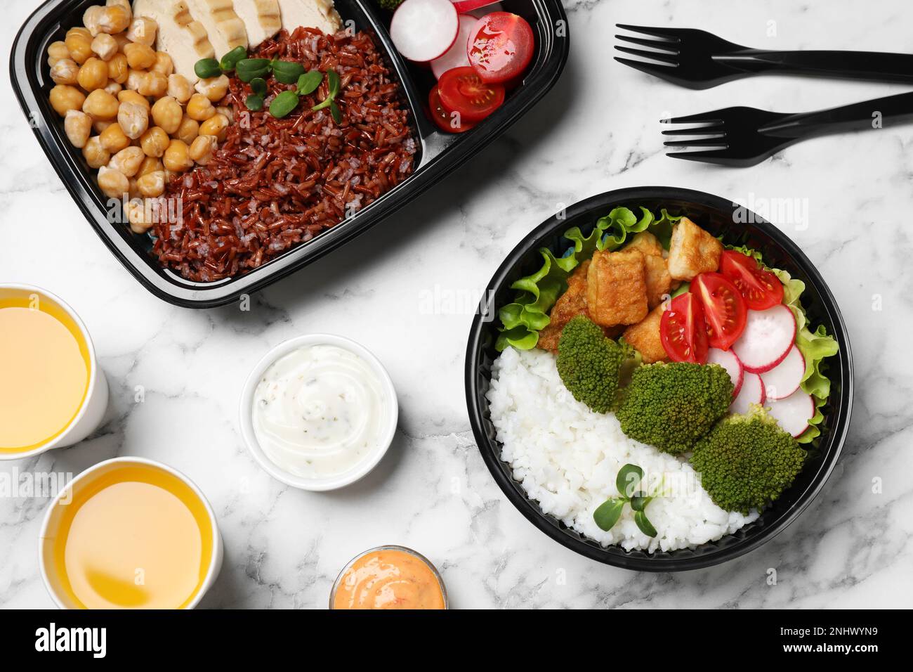 Flat lay composition with healthy takeaway food on white marble table ...