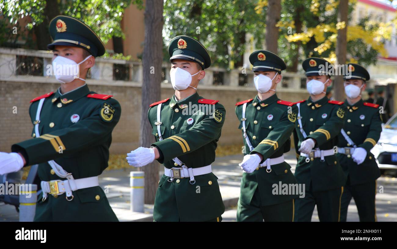 Chinese armed police officers march on a street in Beijing on Nov. 5 ...